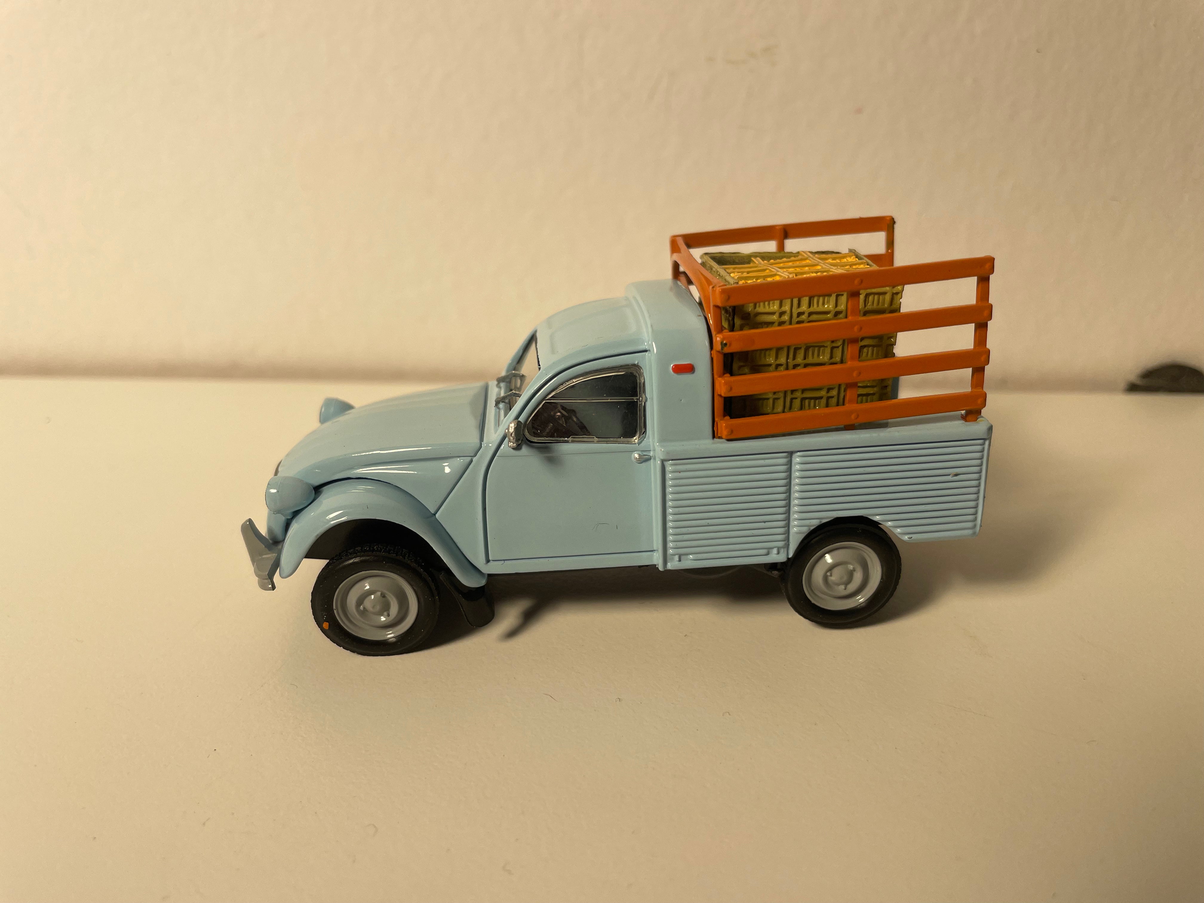 Citroën 2 CV blue flatbed van with brown sides and vegetable crates on ...